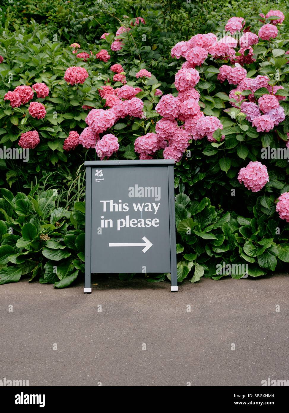 A National Trust property direction this way sign notice board at the ...