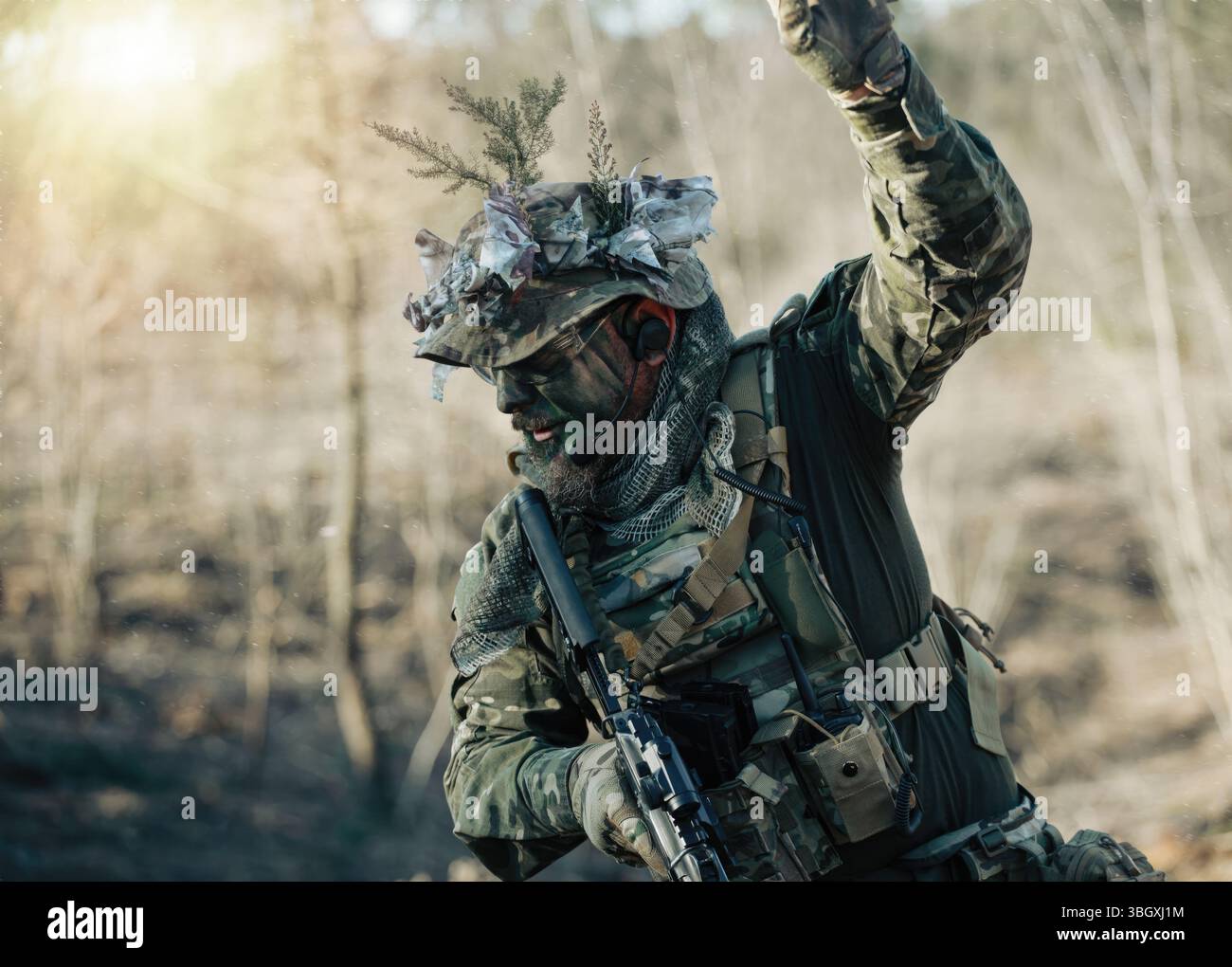 Soldier dressed in camouflage and face paint, carrying a rifle, giving ...