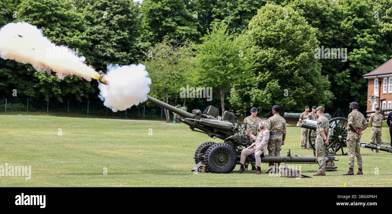 King Charles III fires an artillery piece during his visit to the Royal ...
