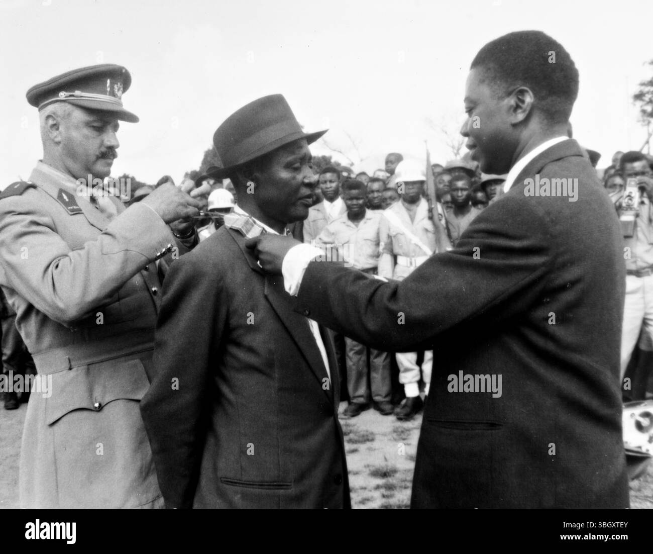 Loyal Baluba chief Kasongo Niembo (centre) receives the Katanga order ...