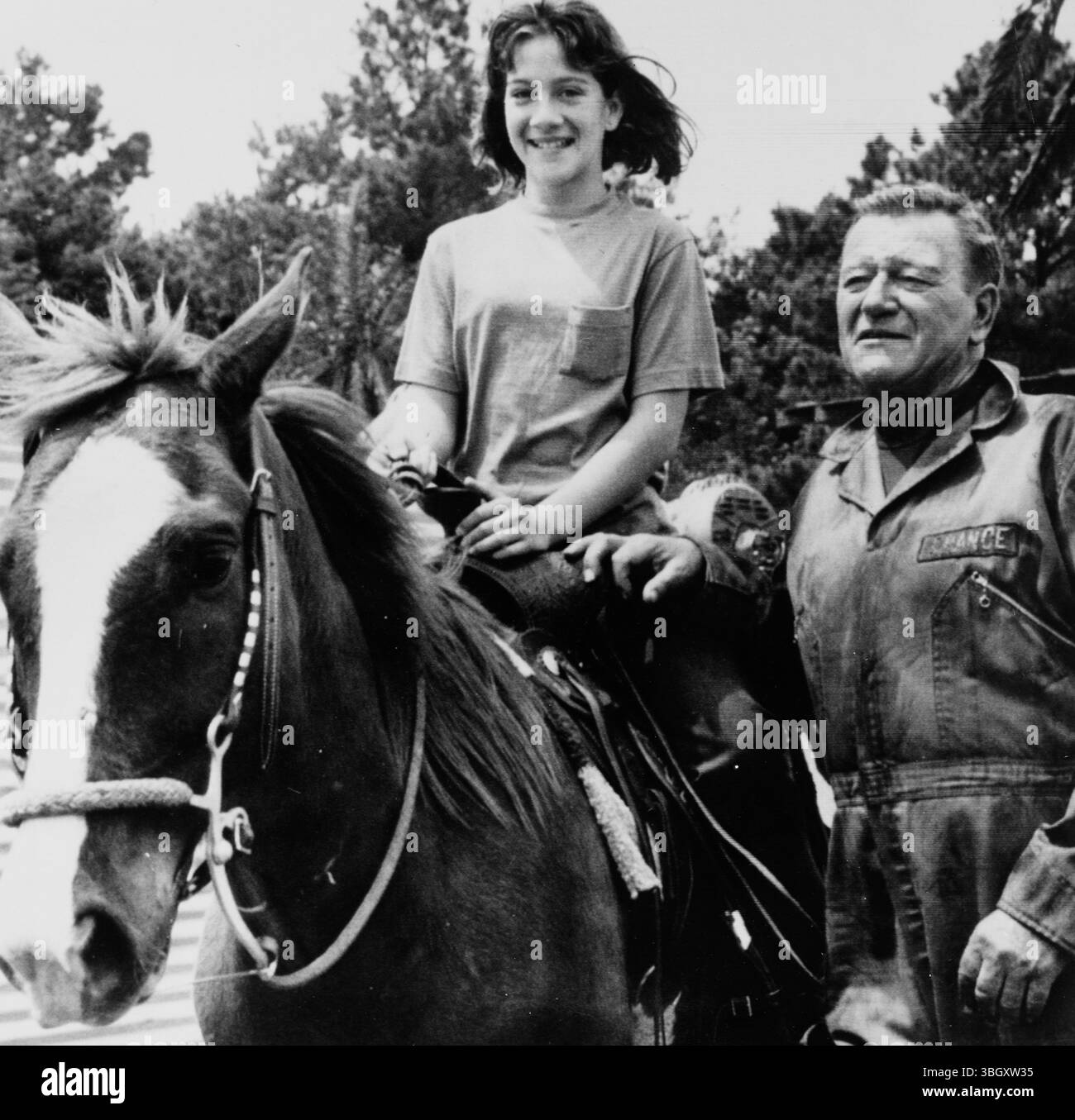 John Wayne (right) and his daughter Aissa, 12, on the set of his new ...