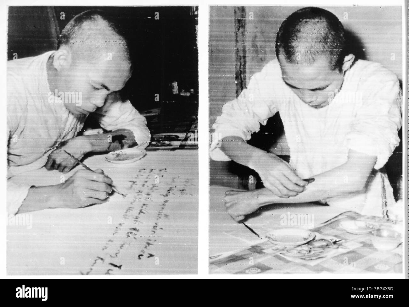Buddhist monk Bonze Minh Trung splashes his arm (right) and writes a ...