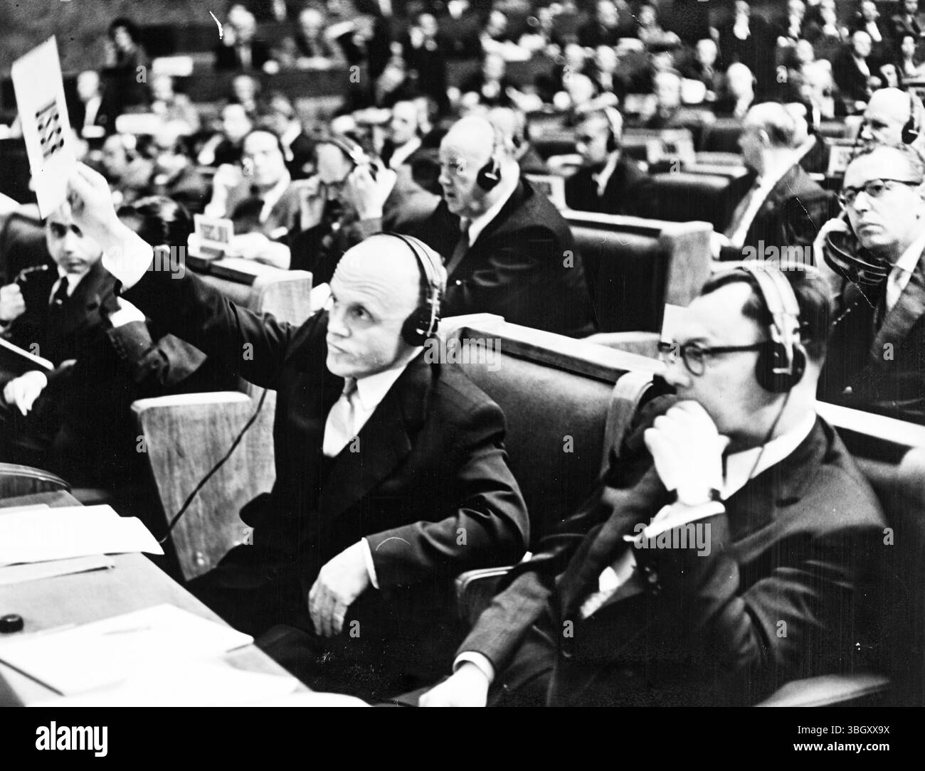 Holding up his nationality plate in the Soviet delegate to the Law of ...