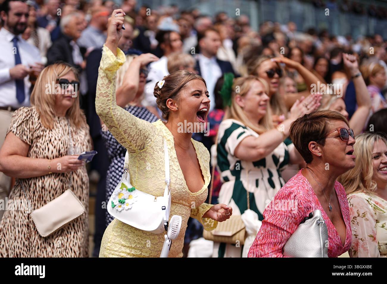 Racegoers cheer during Ladies Day of the Betfred Derby Festival at ...