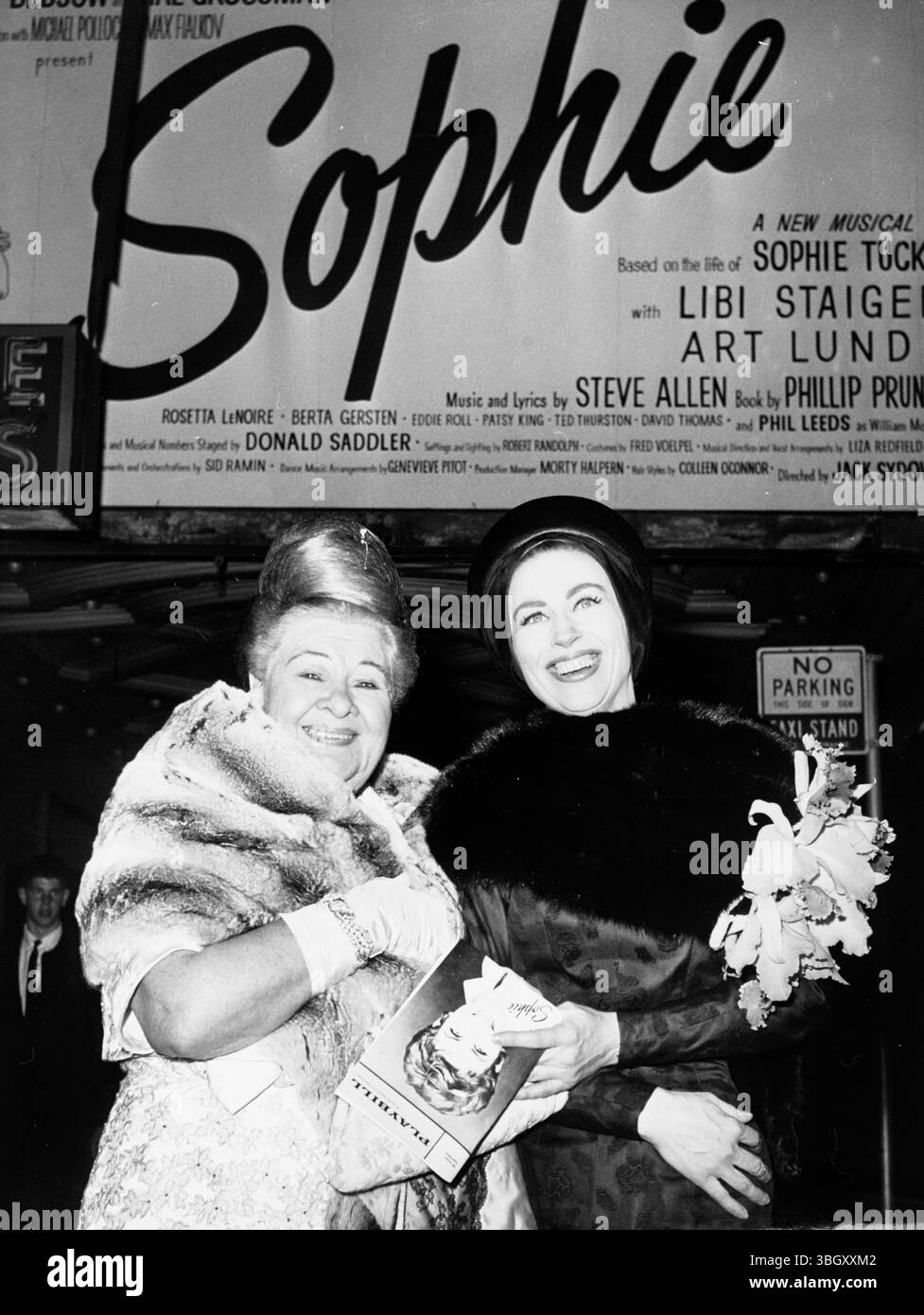 Sophie Tucker (left) happily poses with Libi Staiger under the marquee ...