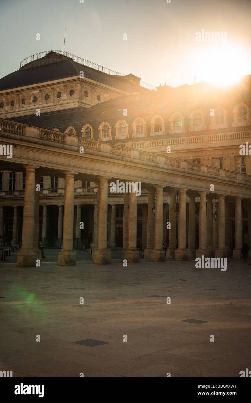 The historic facade and colonnade of the Palais-Royal in Paris are ...