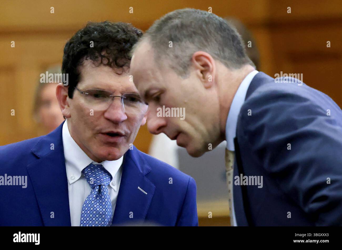 Defense attorneys Robert Alessi, left, and David Yannetti, confer ...