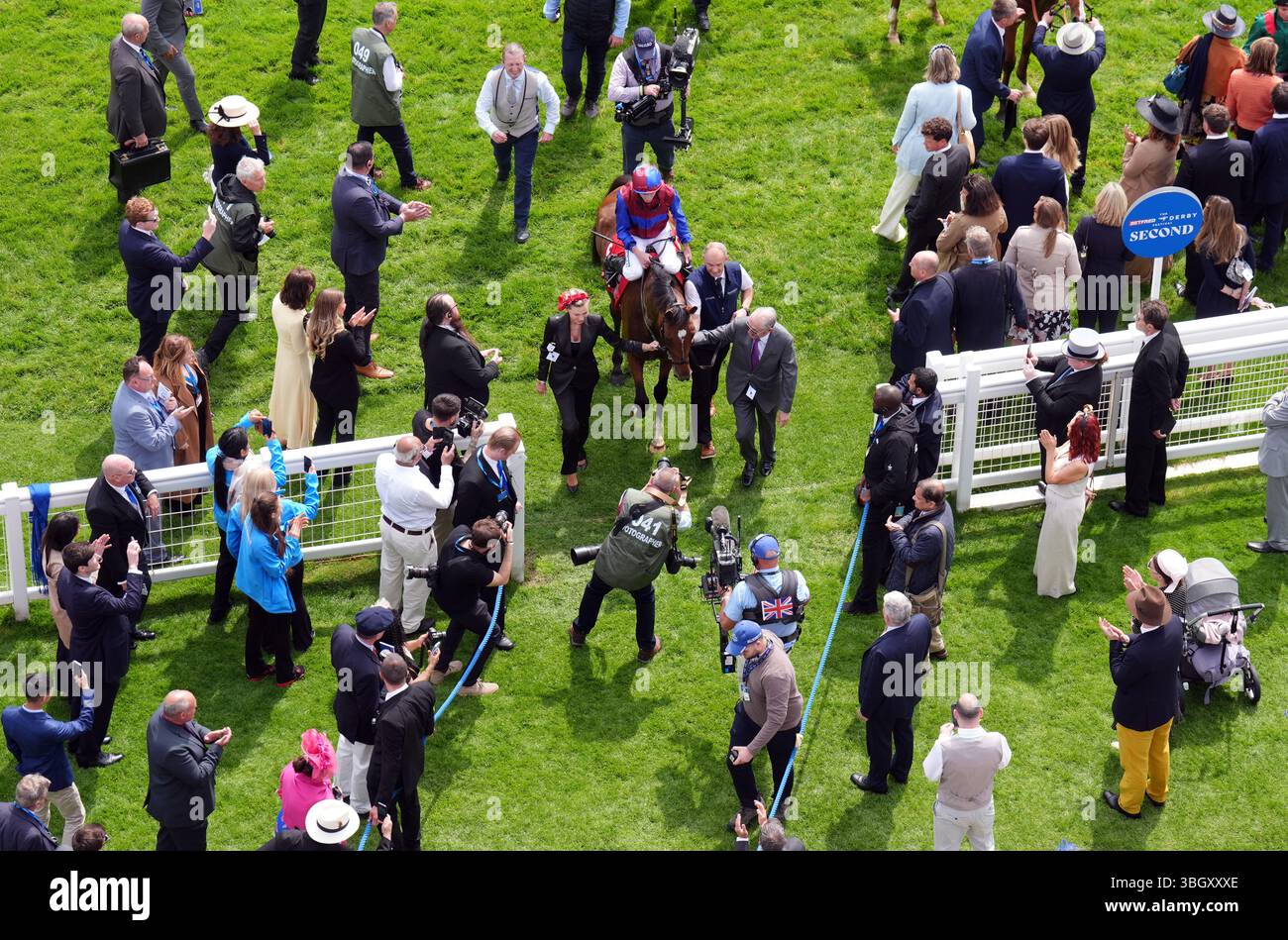 Jan Brueghel ridden by Ryan Moore is led into the winners enclosure ...