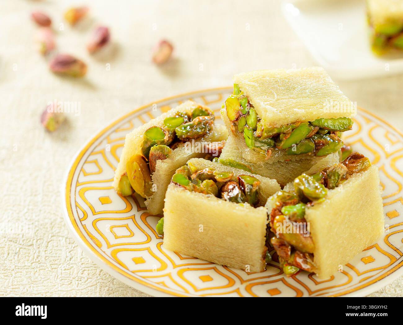 Ballorieh or pistachio baklava, Arabic Middle Eastern dessert, white ...