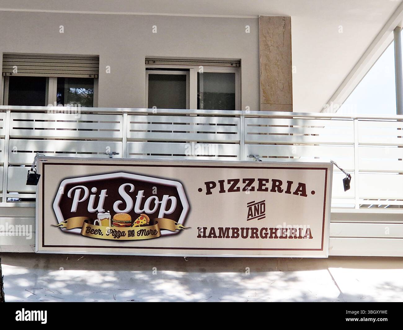 Outdoor Signboard Displaying Pit Stop Pizzeria and Hamburgeria ...
