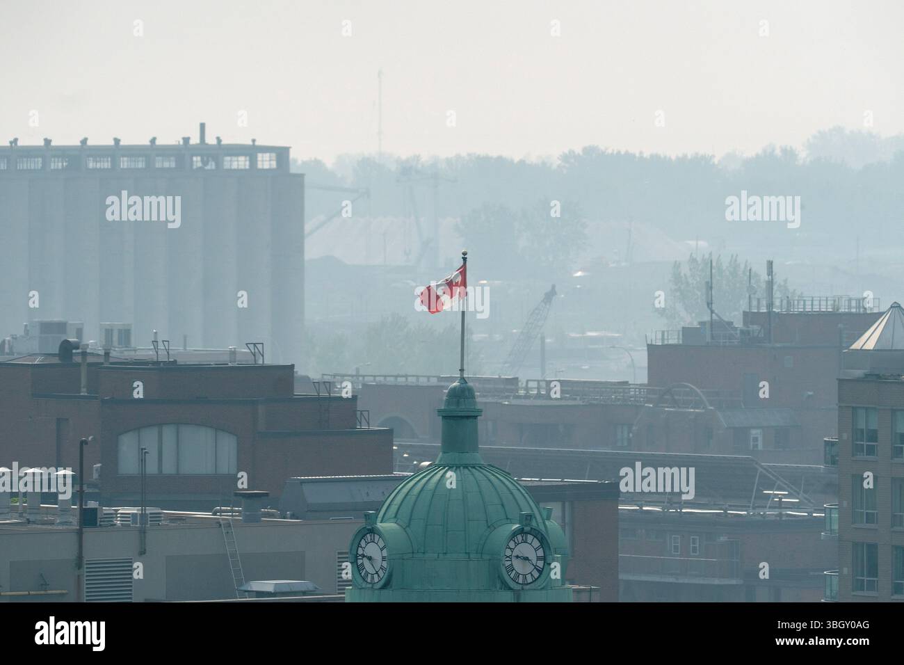 Toronto, Canada. 06th June, 2025. A Canadian flag flies on a flagpole ...