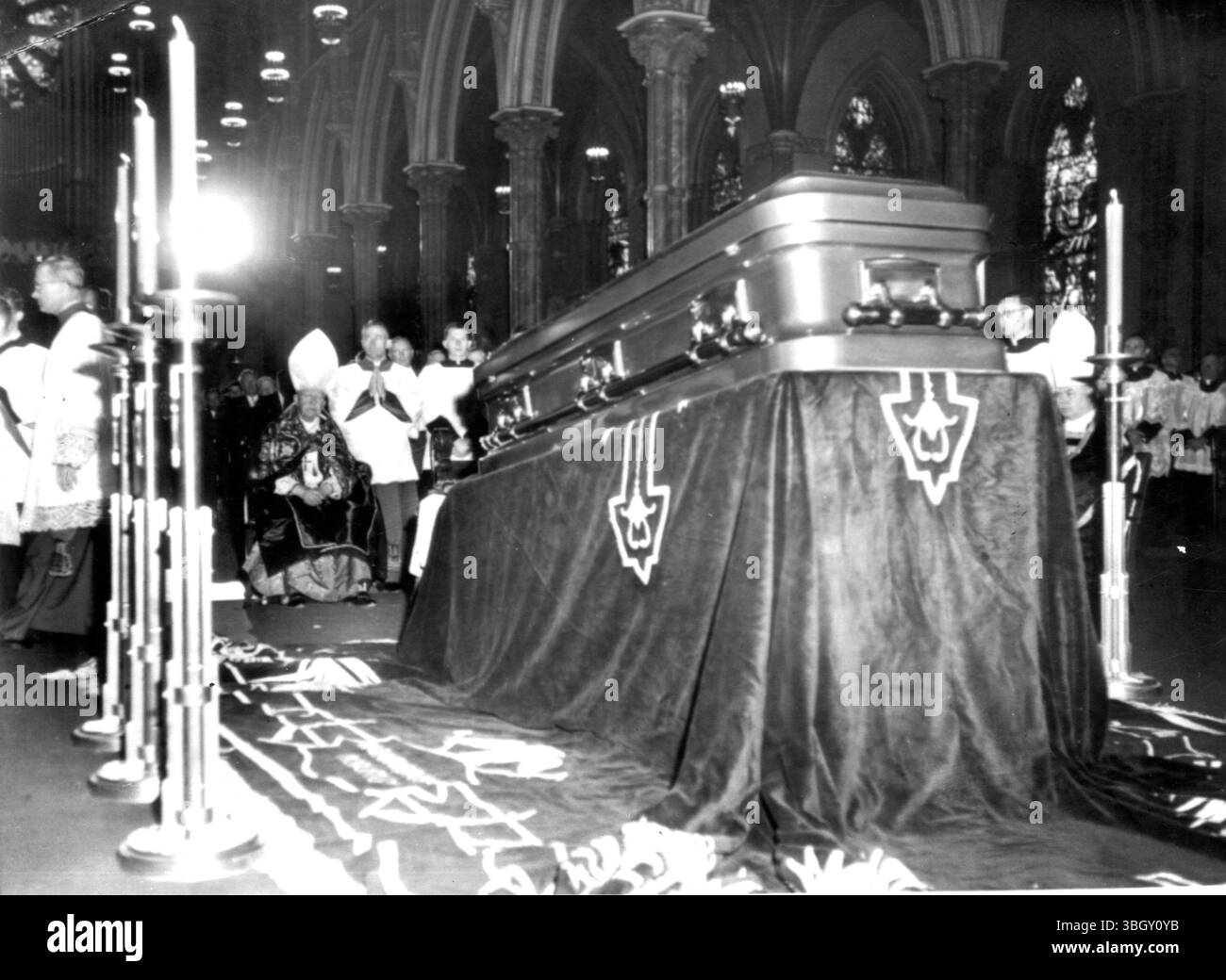 Edward Cardinal Moonsy of Detroit is shown before the 'bier' of Samuel ...