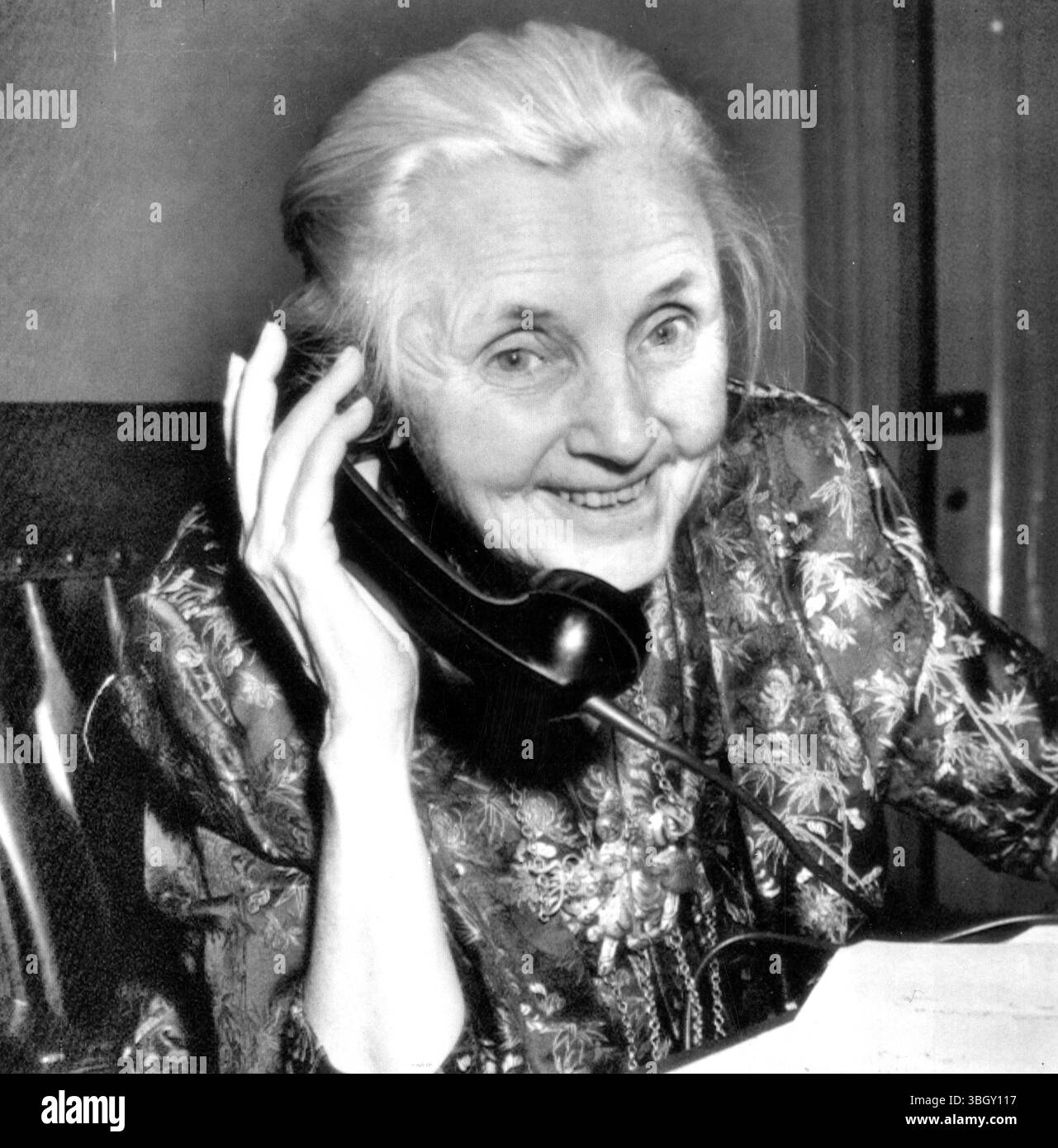 Anna Louise Strong, 70, talks to reporters over the telephone from her ...