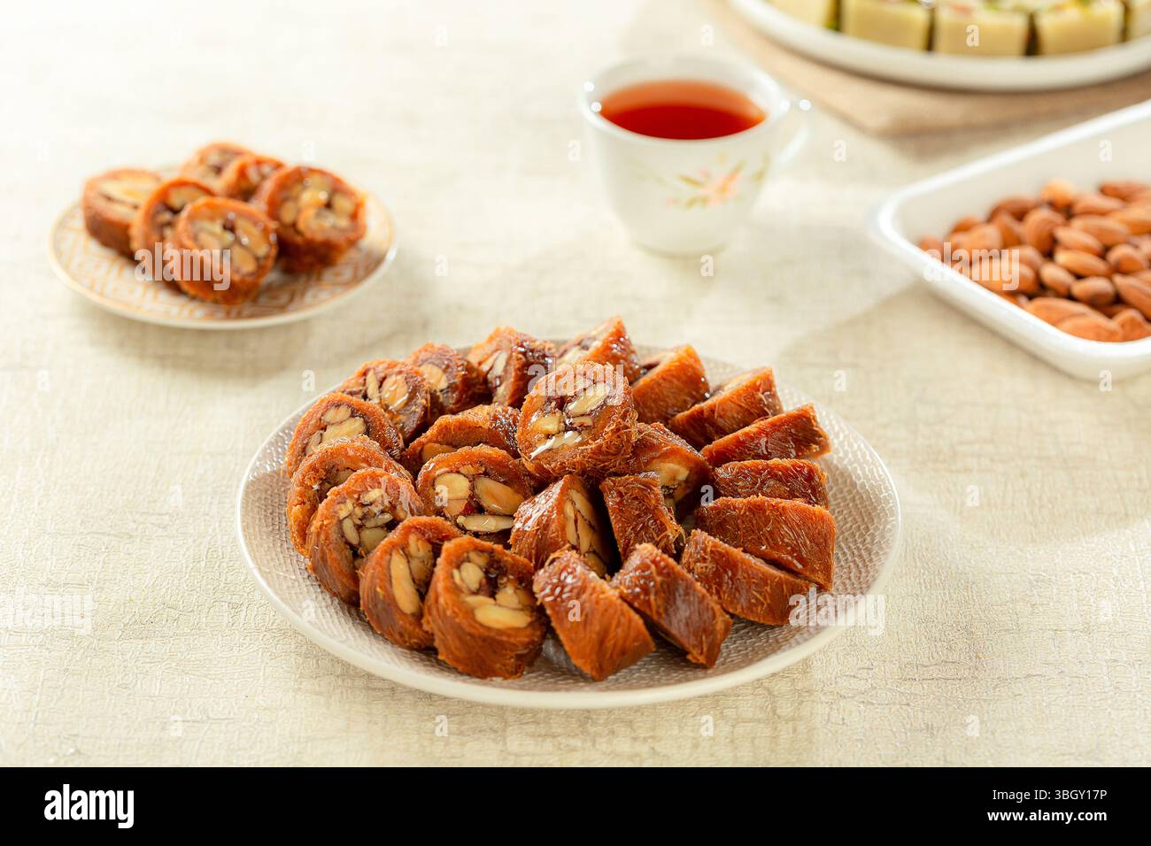 Plate of Arabic Middle Eastern sweets, almond knafeh fingers Stock ...