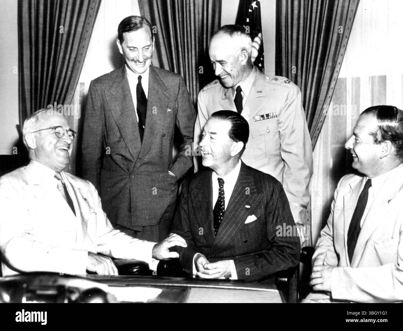 President Truman enjoys a hearty laugh with British defence Minister ...
