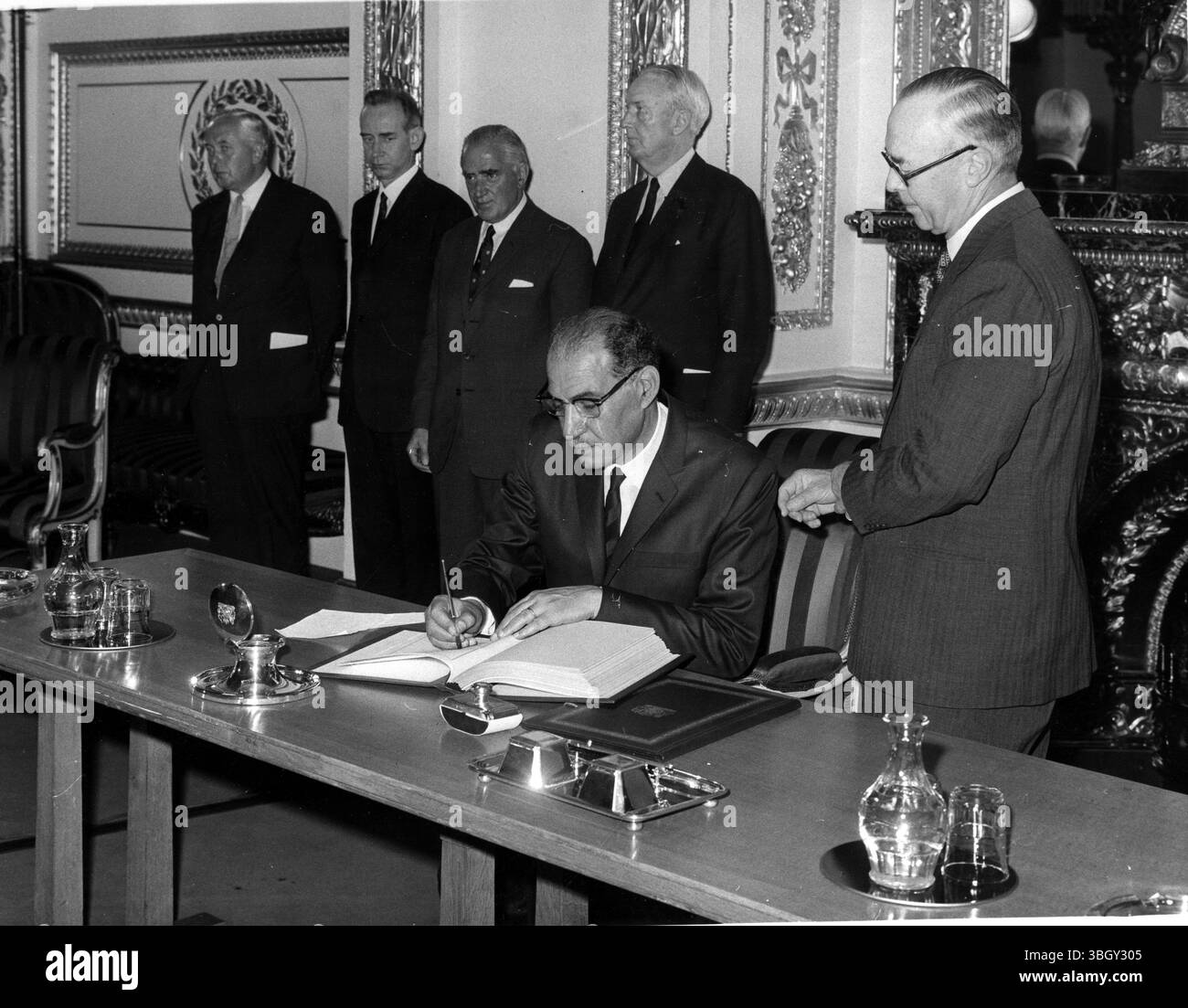 United Arab Republic ambassador in London Ahmed Hassan El-Seki signing ...