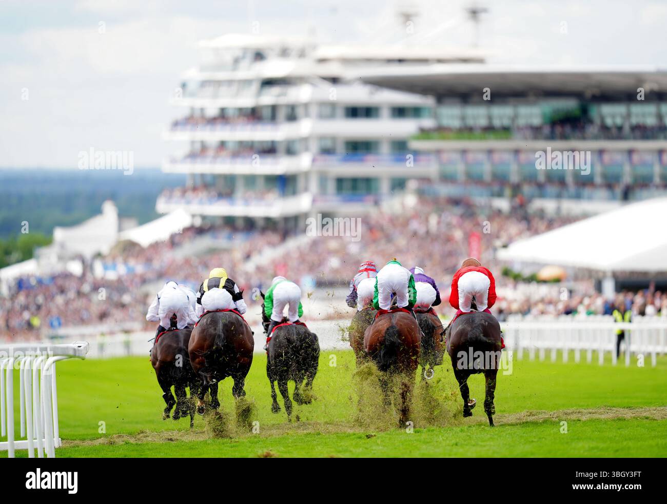 Runners and riders in the Betfred British EBF Woodcote Stakes during ...