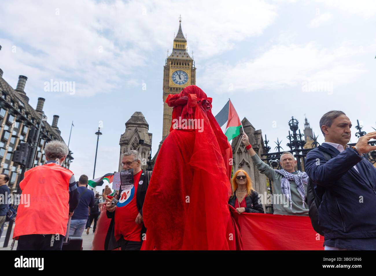 Pro-Palestinian protesters wearing red create a red line for Palestine ...