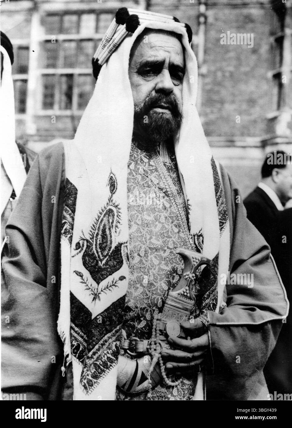 Shaikh Abdullah Al Salim Al Sabah of Kuwait wears his wrist watch on ...