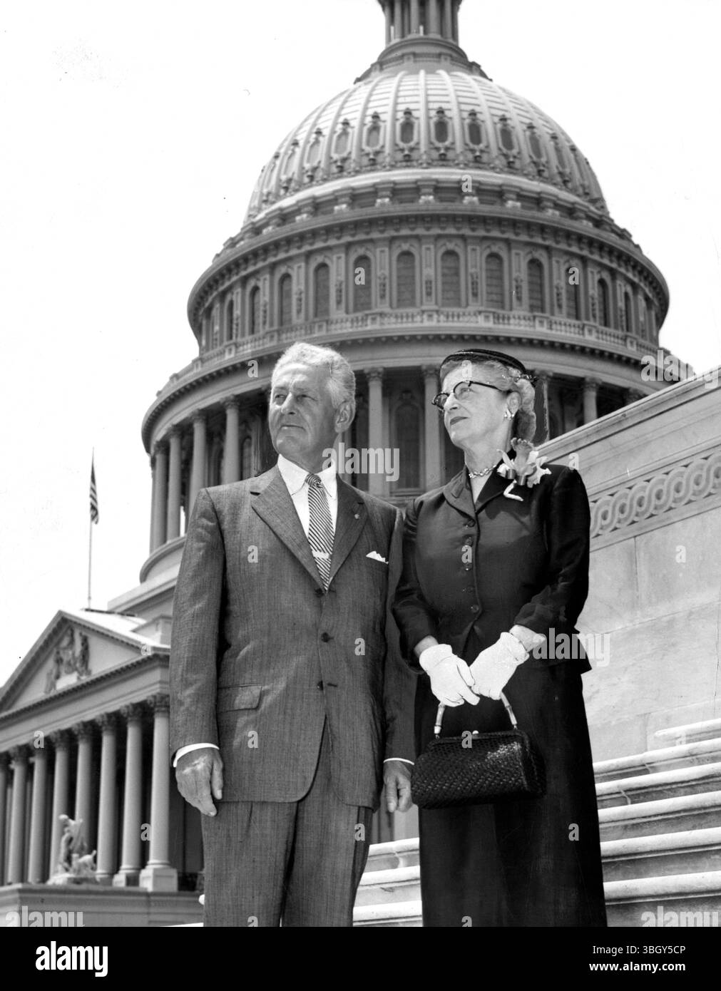 Senator Sam W Reynolds poses with his wife on the steps of the Capitol ...