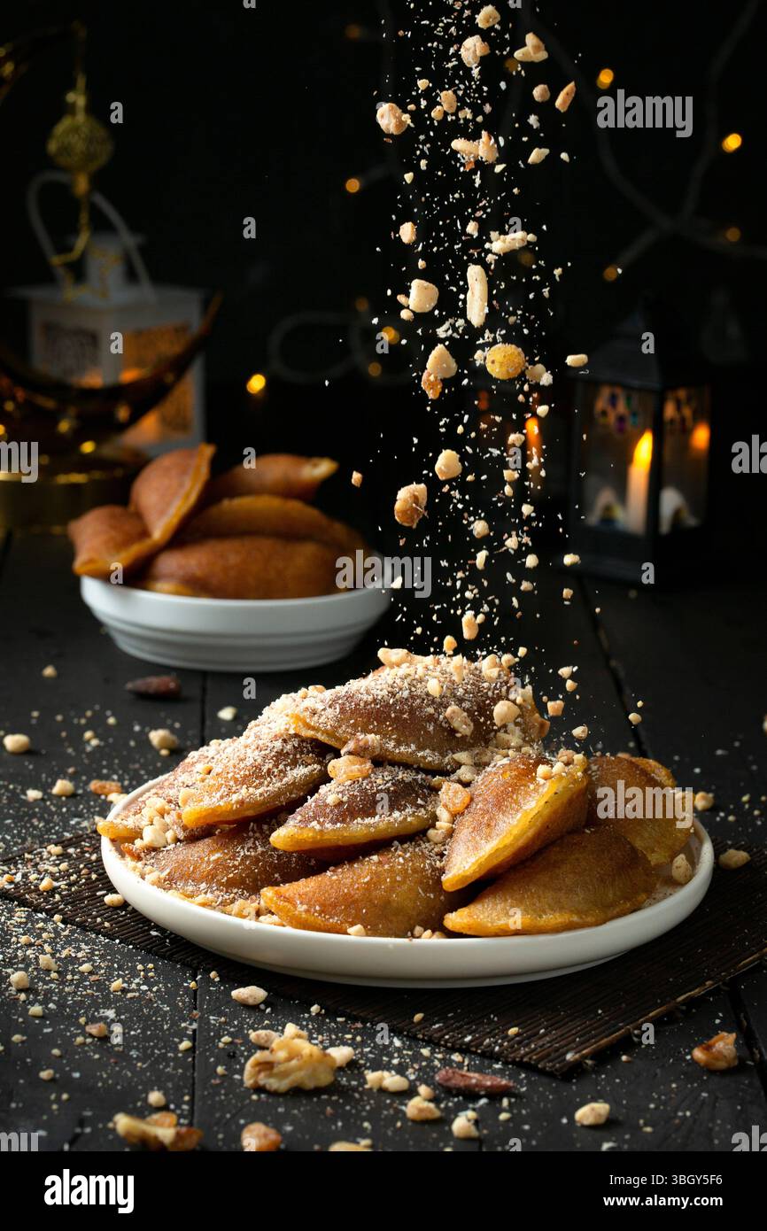 Qatayef, crispy Arabic Middle Eastern dessert filled with nuts Stock ...