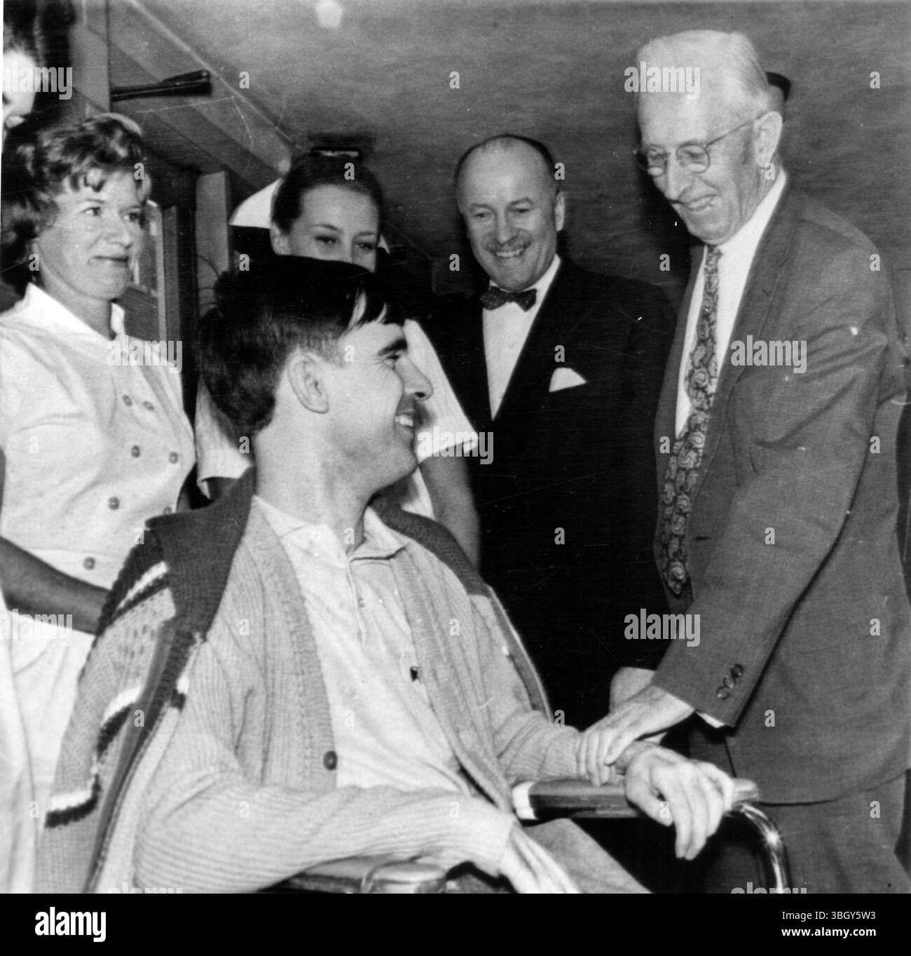 Bernard Proulx, gets a pat on the arm from Dr Gordon Murray who, in an ...