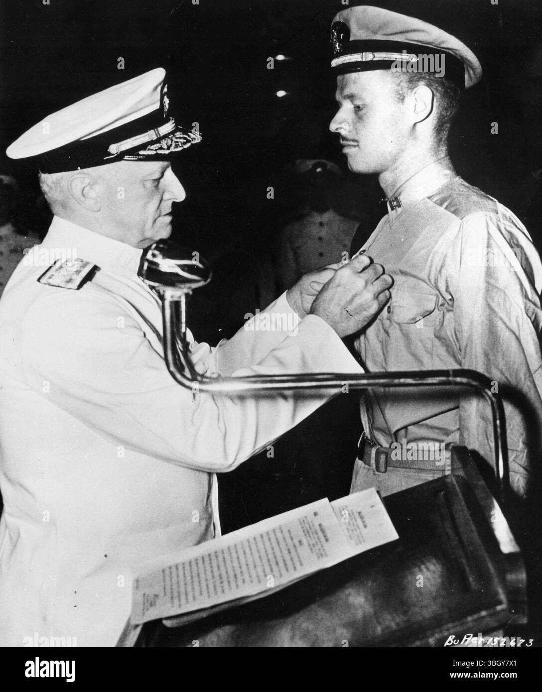 Admiral Chester W. Nimitz pins the Silver Star on his son, Lieutenant ...