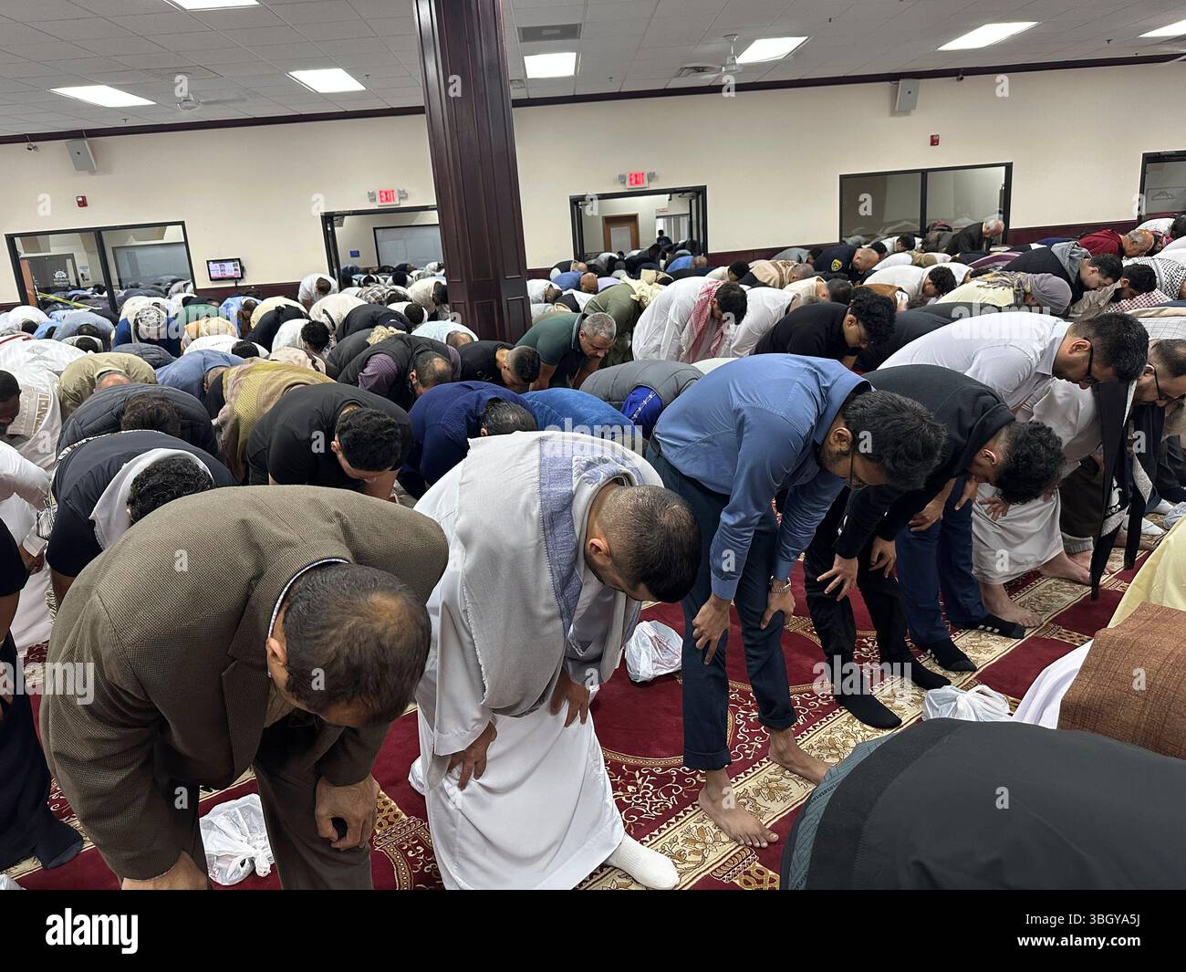 Worshippers take part in a prayer service marking the Muslim holiday of ...