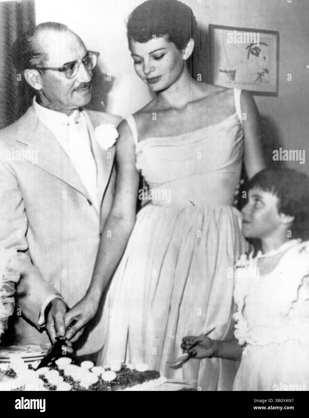 Veteran film and television comedian Groucho Marx and his bride, the ...