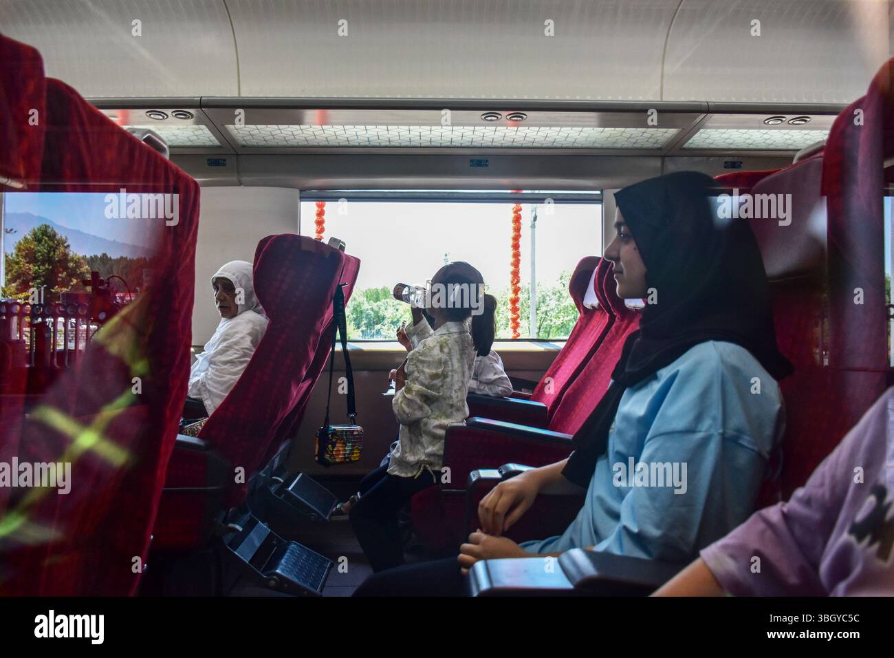 Srinagar, India. 06th June, 2025. Passengers seen on their seats inside ...