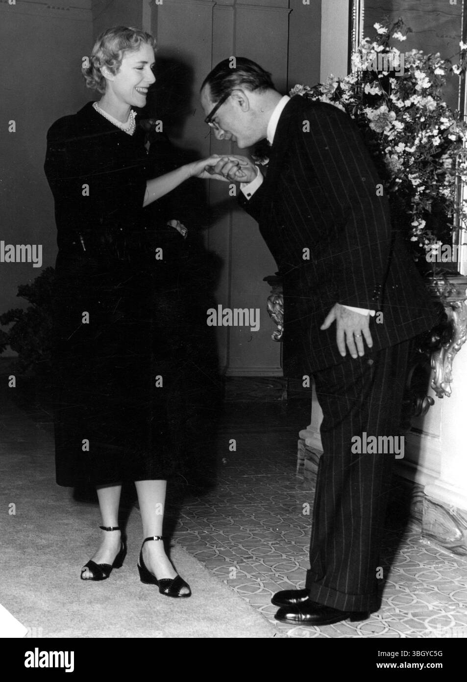 Italy's Chief of Protocol Baron Michele Scamacca (right) bows to kiss ...