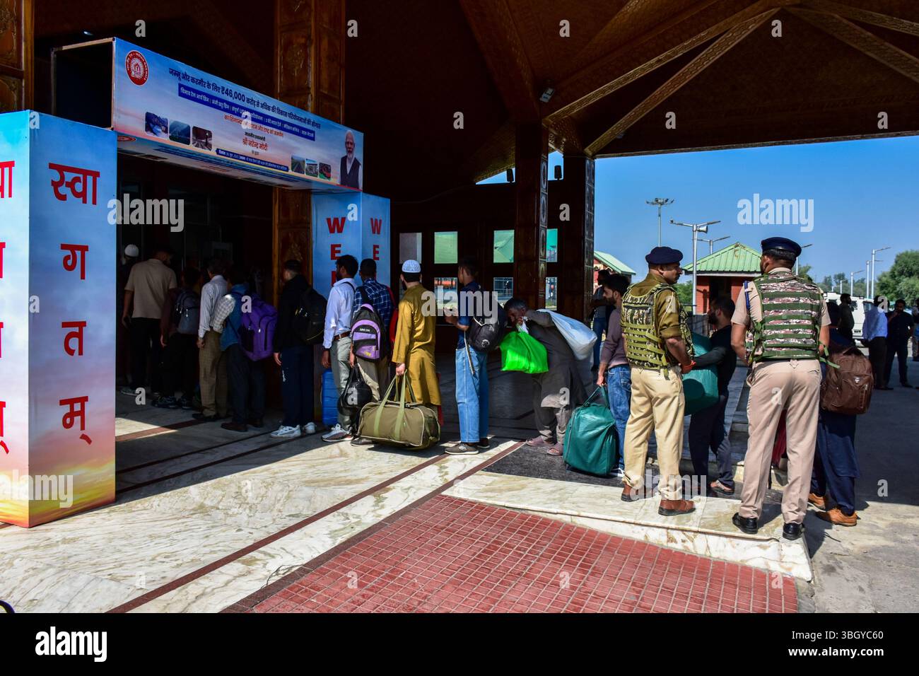 Srinagar, India. 06th June, 2025. People stand in a queue as they wait ...