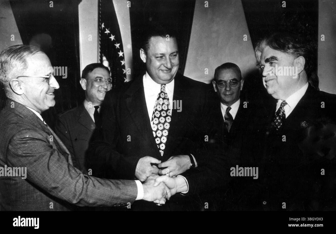 Mr Julius Albert Krug (centre), Secretary of the Interior, President Harry S. Truman, and Mr ...