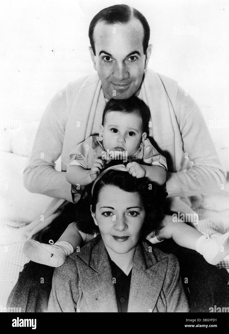 Al Jolson, Ruby Keeler (Mrs Jolson) and their adopted son Albert ...