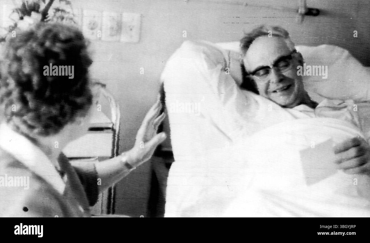 Gets visit from wife. American agronomist Claude Fly talks to his wife ...