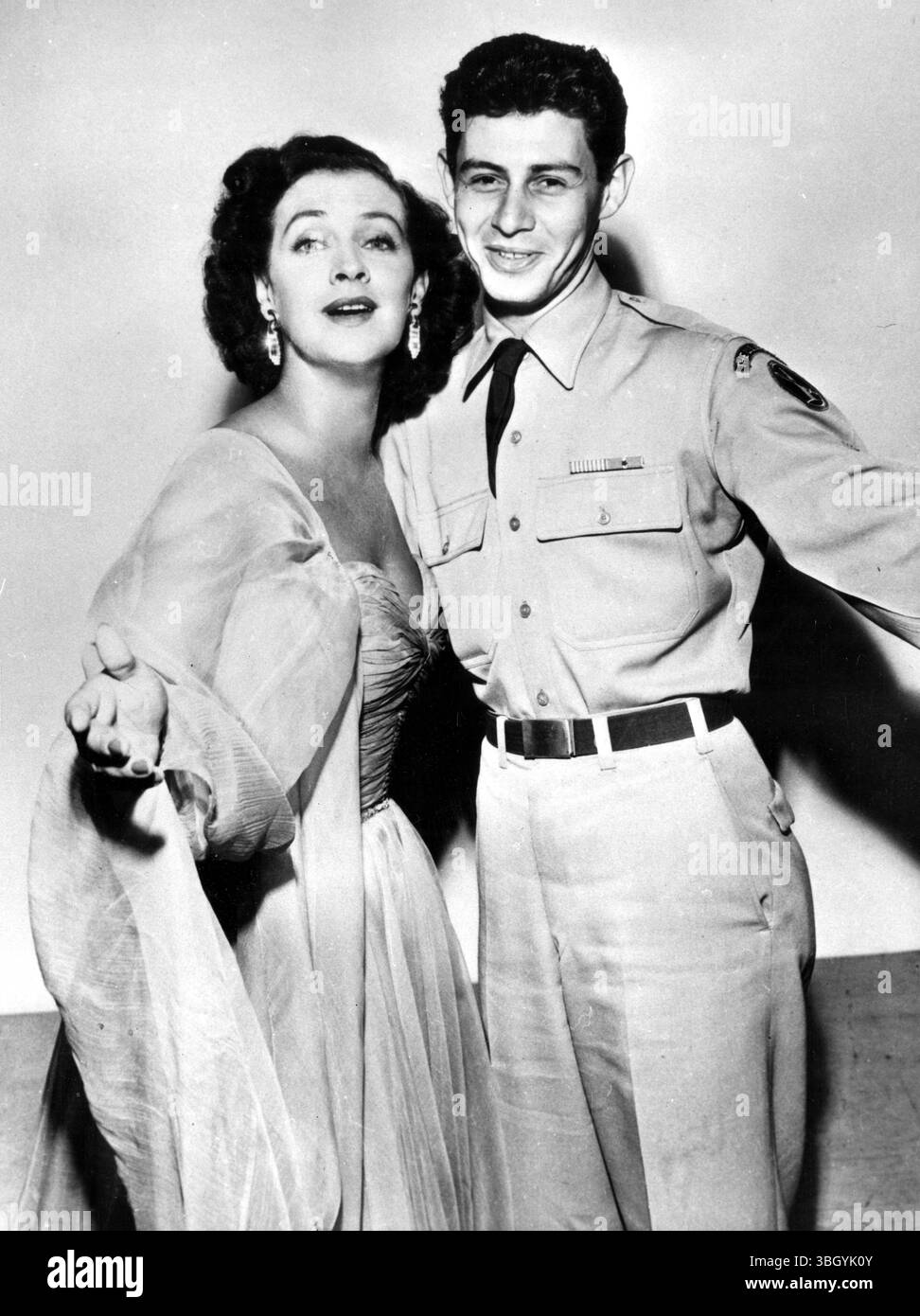 With a song in their hearts. Singer Jane Froman, who is in the middle ...