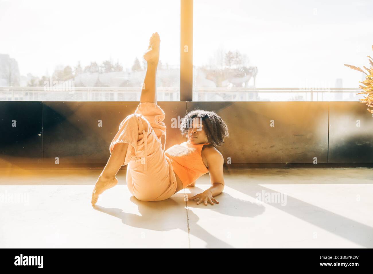 Serene woman lying on floor hi-res stock photography and images - Alamy