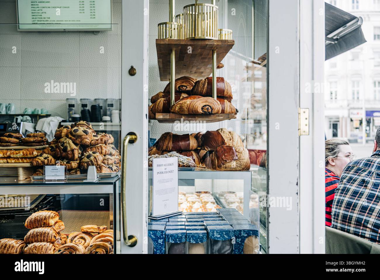 Bakery window filled with croissants and pastries on display Stock ...