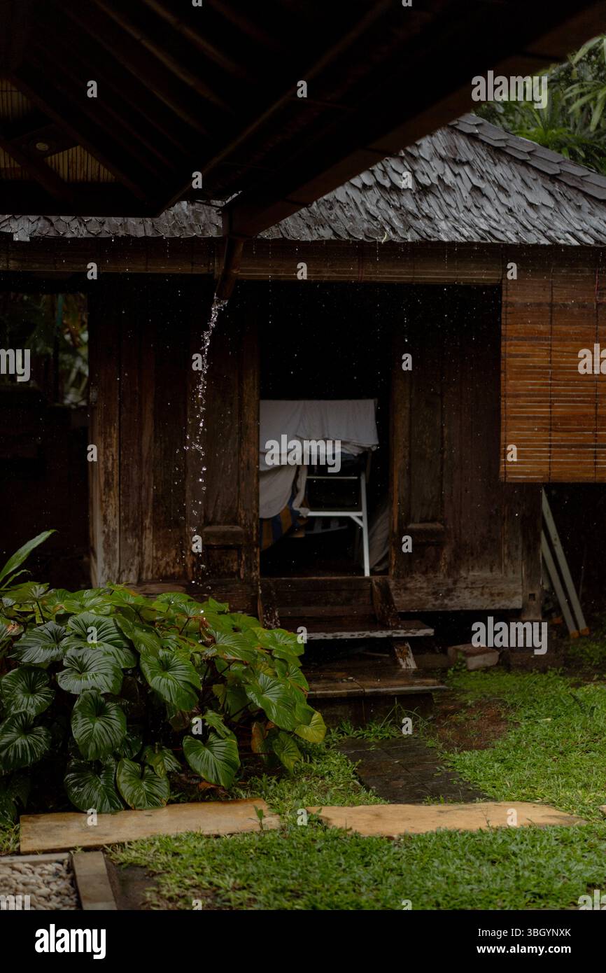 Rustic wooden hut in the rain Stock Photo - Alamy