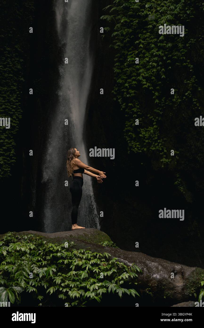 Yoga pose under waterfall hi-res stock photography and images - Alamy