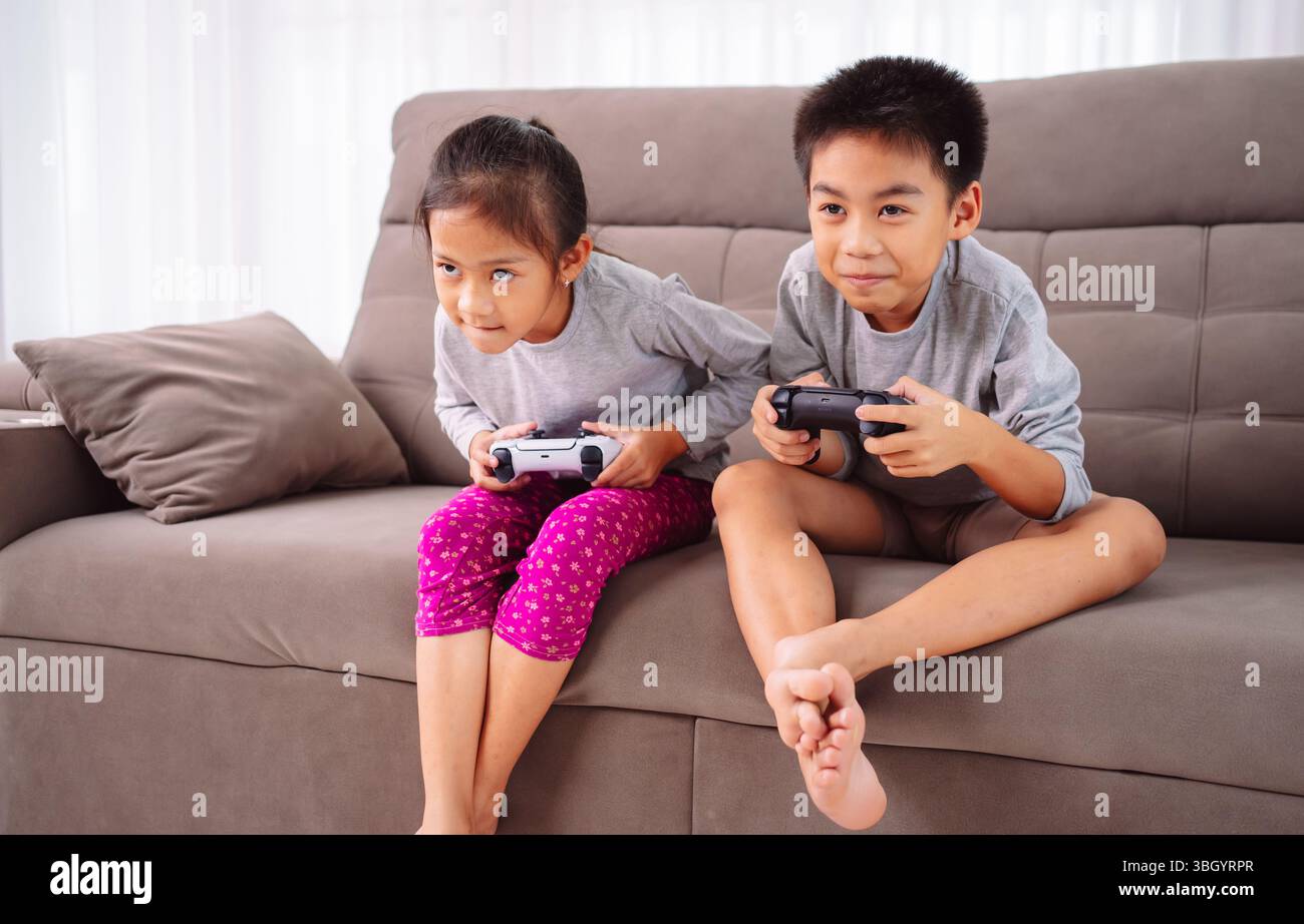 Child Asian Playing Video Game Friends Boy Girl Entertainment Video ...