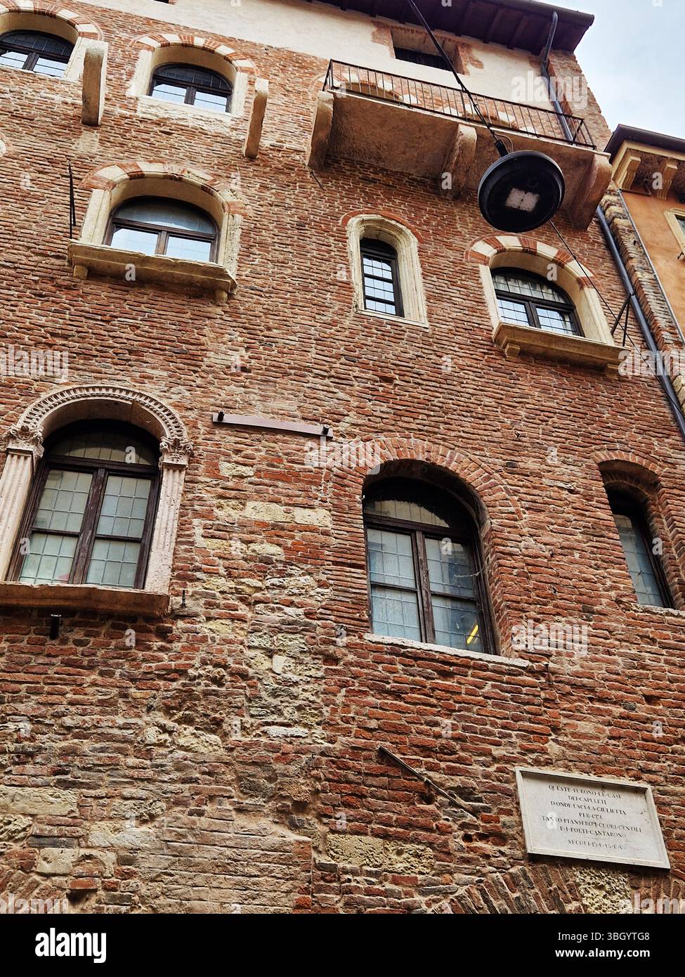 Historic Brick Building With Arched Windows and Rustic Architectural ...