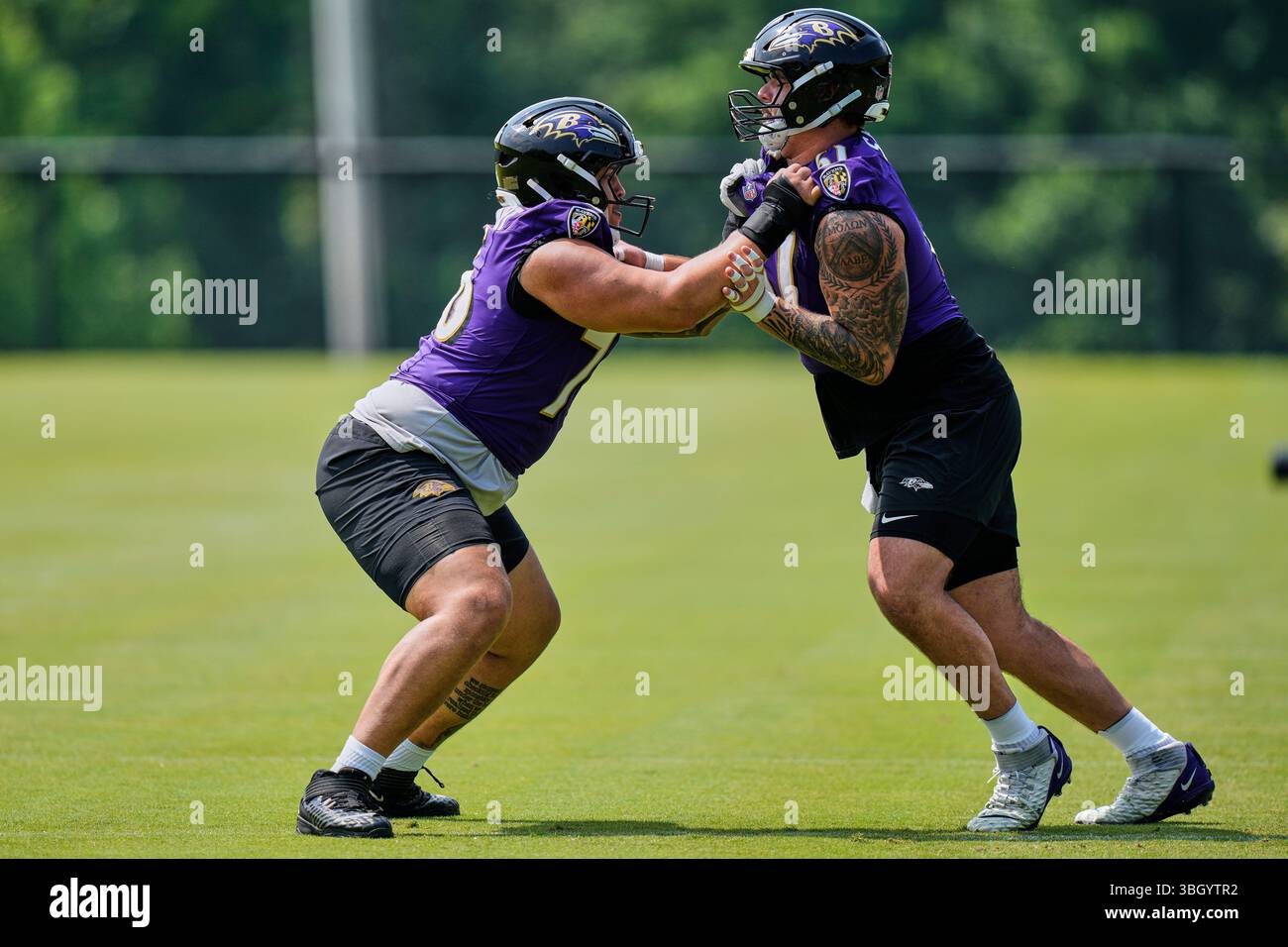 Baltimore Ravens guard Darrian Dalcourt, left, and center Nick Samac ...