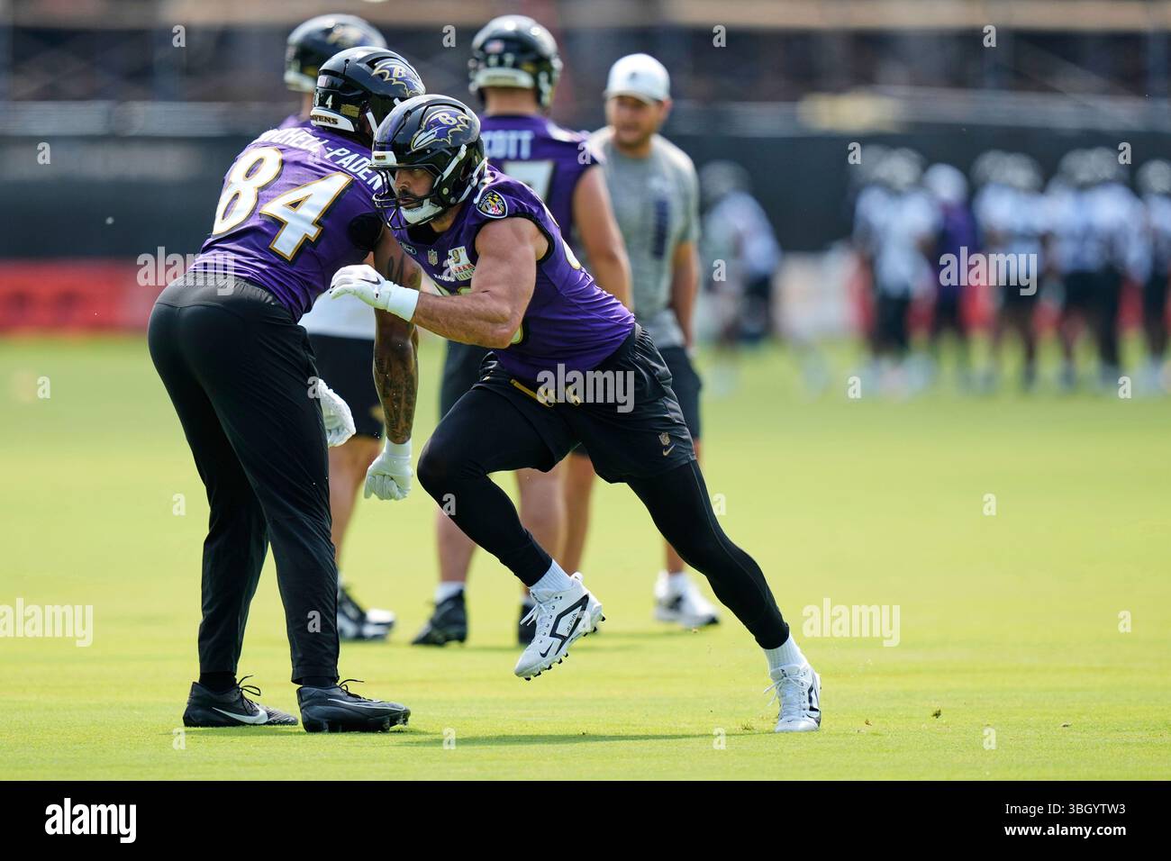 Baltimore Ravens tight end Mark Andrews, right, works out alongside ...