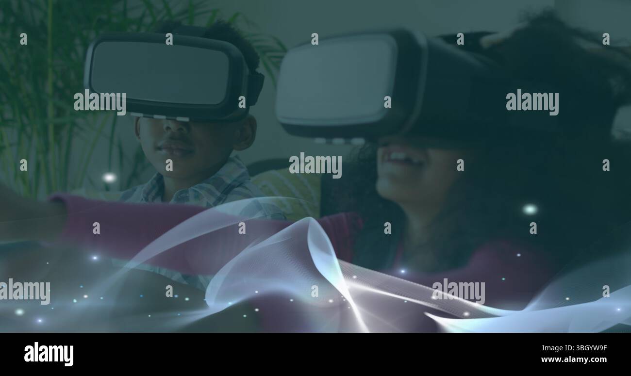 Image of waves over african american boy and girl in vr headset Stock ...