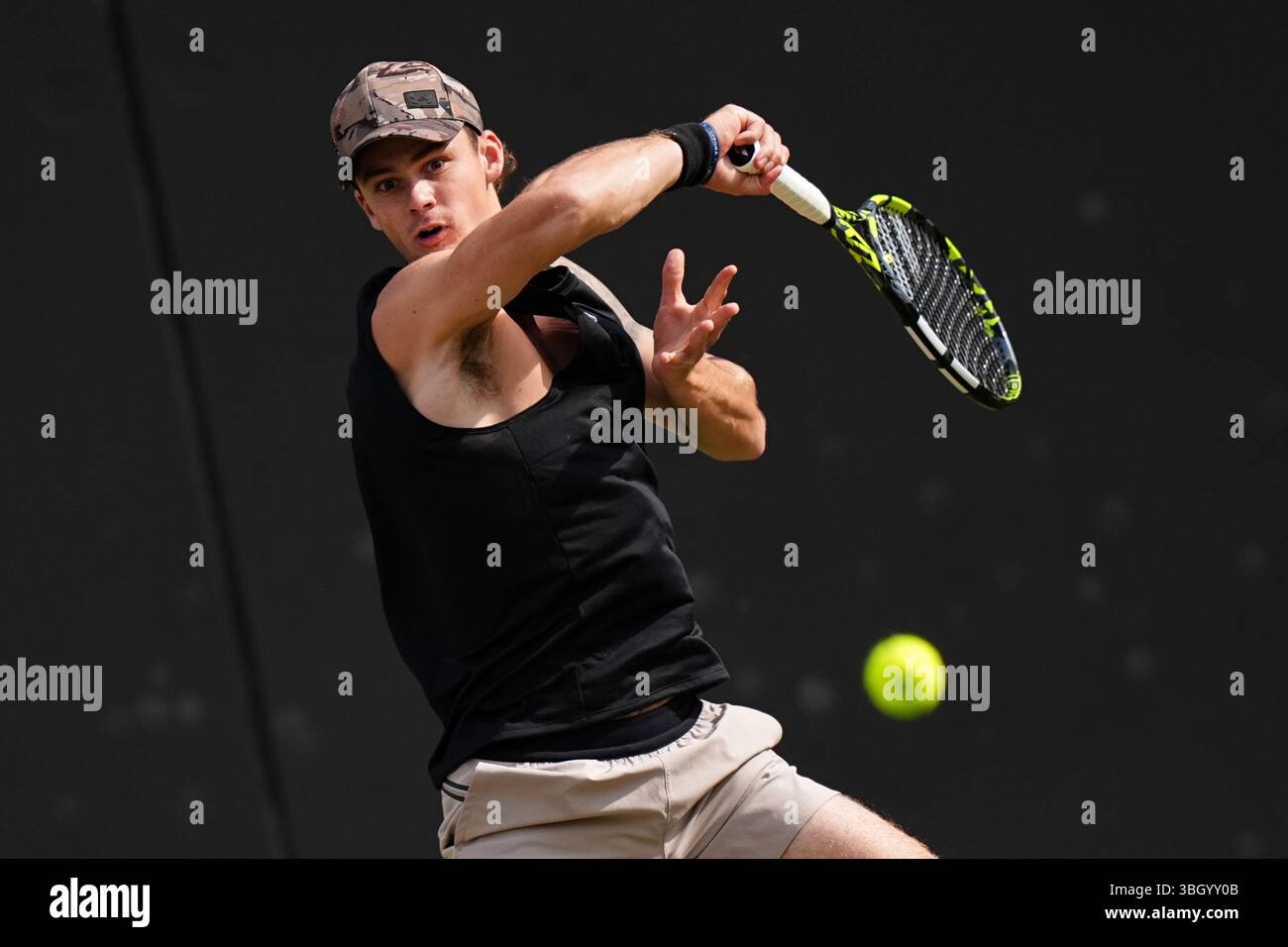 Colton Smith in action during his match against Lloyd Harris on day ...