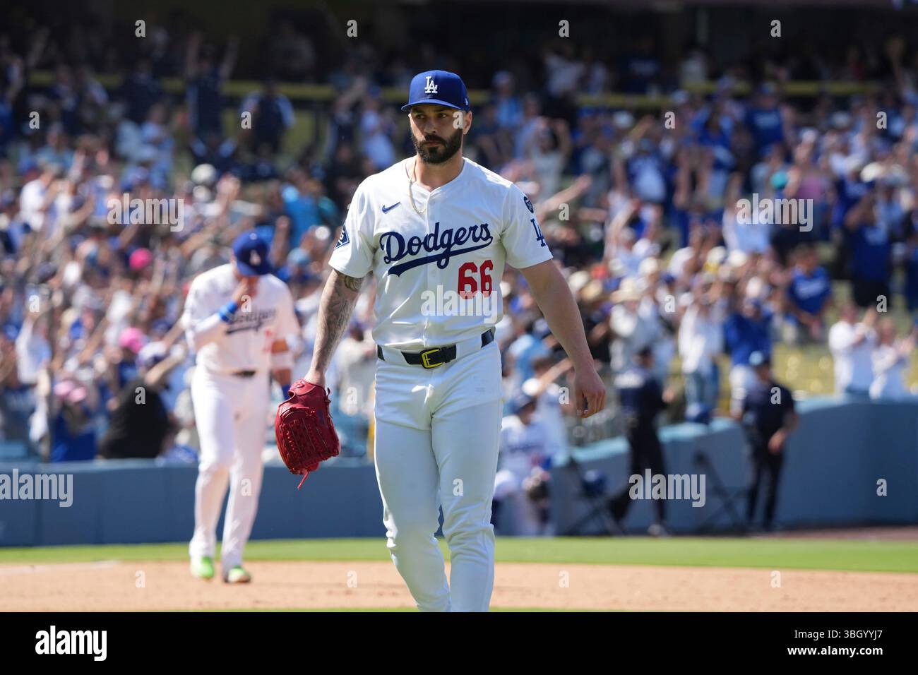 Los Angeles Dodgers relief pitcher Tanner Scott (66) reacts at the end ...