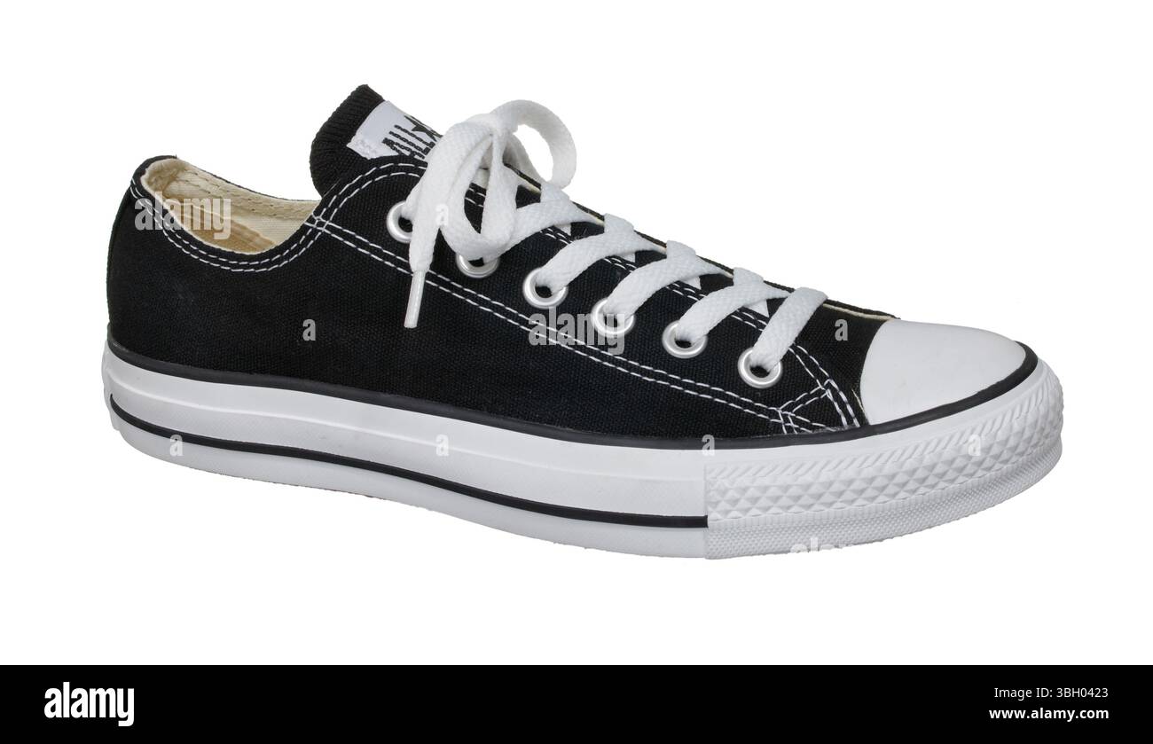 black converse shoe photographed on a white background Stock Photo - Alamy