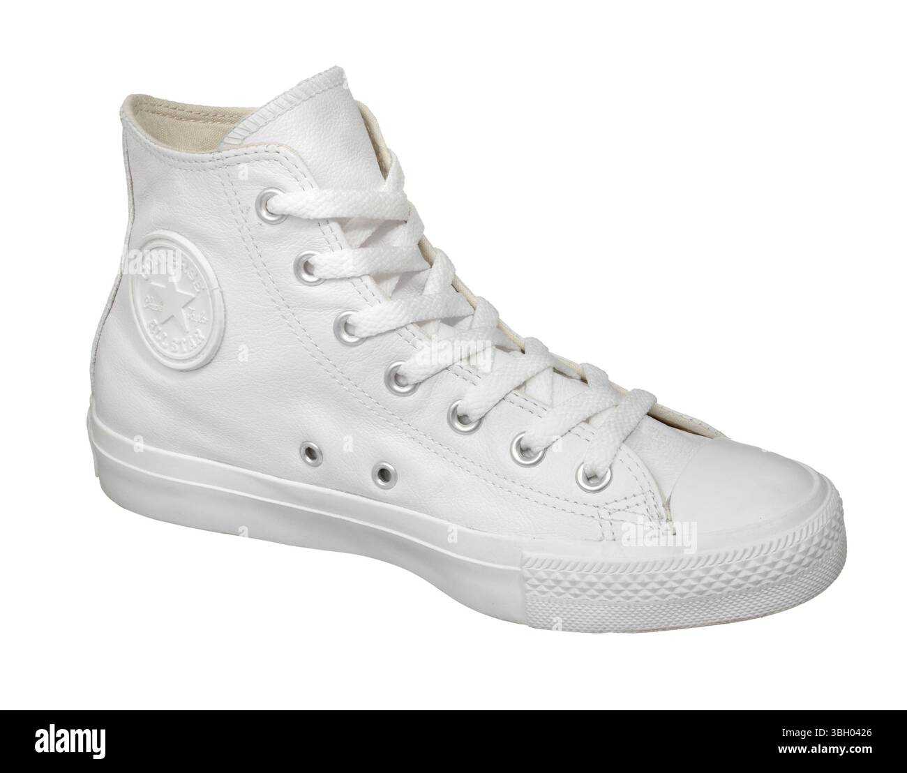 white converse photographed on a white background Stock Photo - Alamy