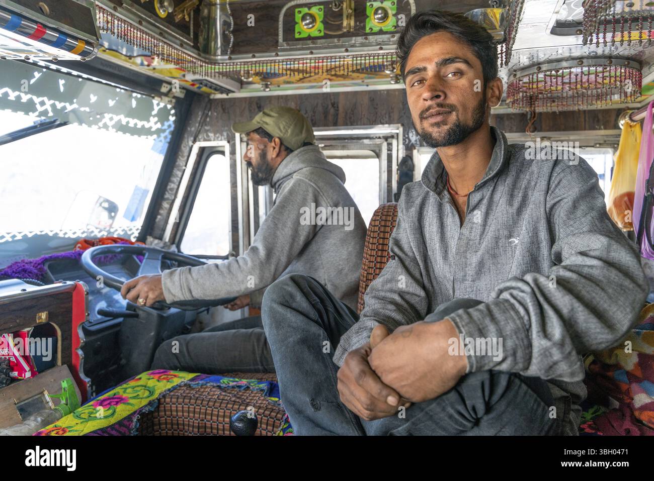 The portrait of indian truck driver and his helper Stock Photo - Alamy